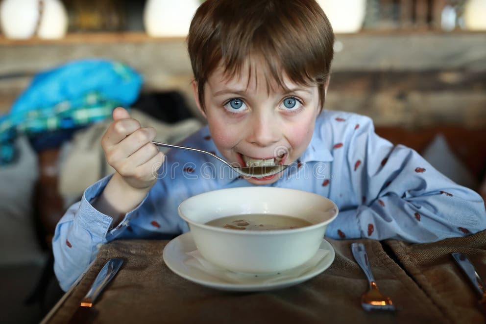 Boy Eating Dumplings with Broth Stock Image - Image of diner, broth ...