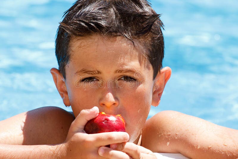 Boy Eating Fruit in Swimming Pool Stock Photo - Image of cute, pool ...