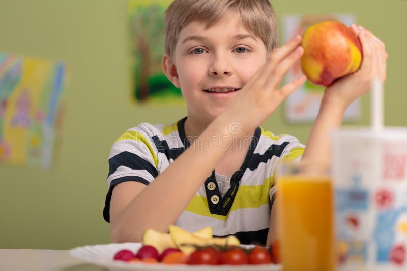 Boy Eating Fruits for Lunch Stock Image - Image of desk, nutricious ...