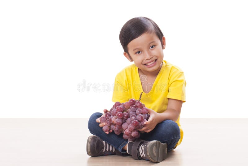 Boy eating grapes stock photo. Image of seeds, juicy - 44634192