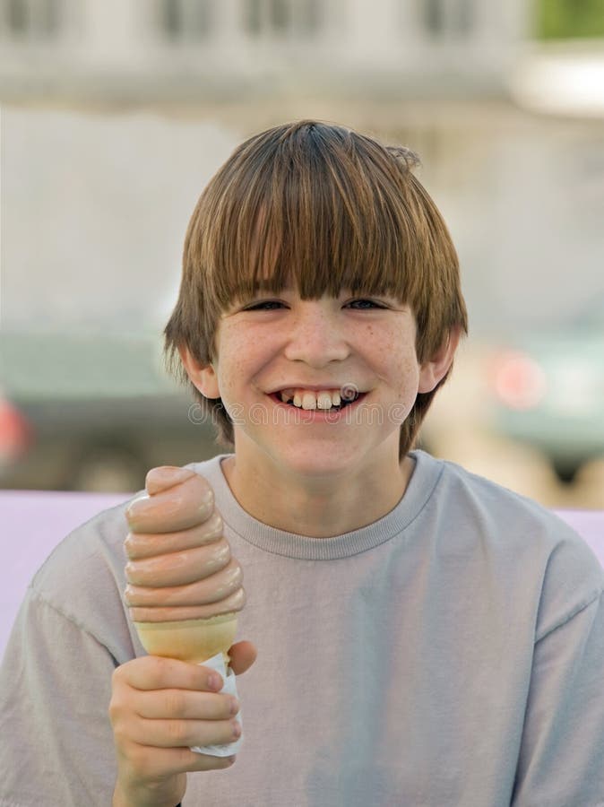 Boy Eating an Ice Cream Cone Stock Image - Image of happy, teenager ...