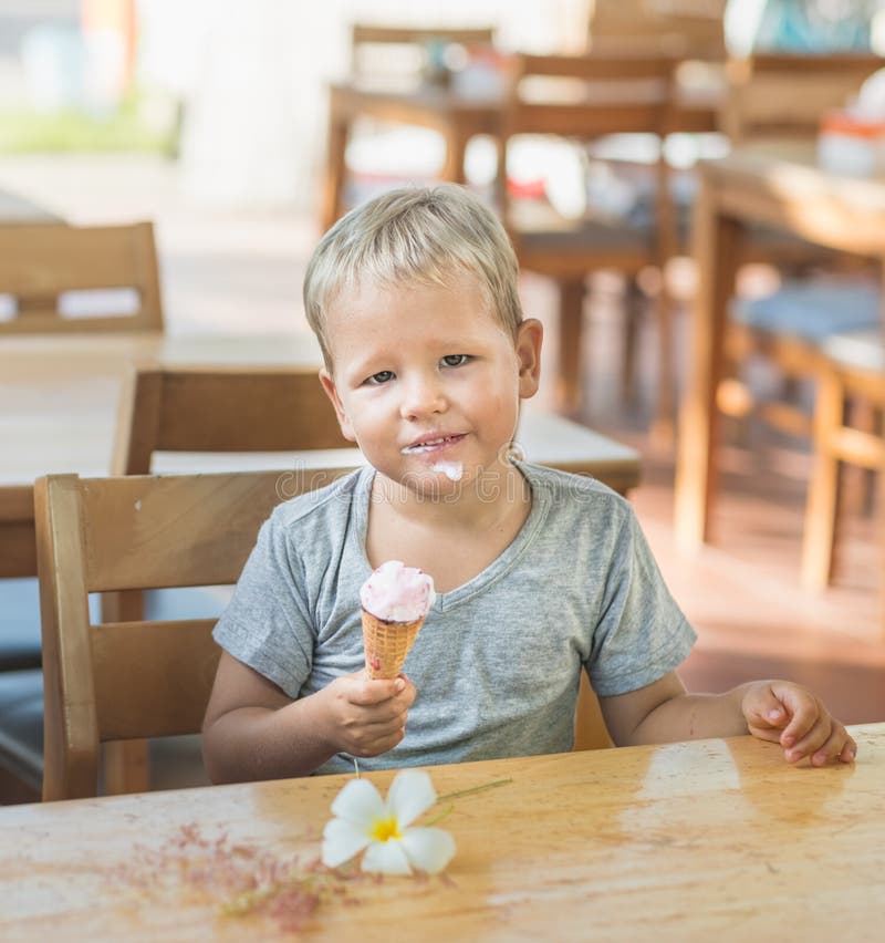 Boy eating ice cream stock photo. Image of concept, leisure - 126937322