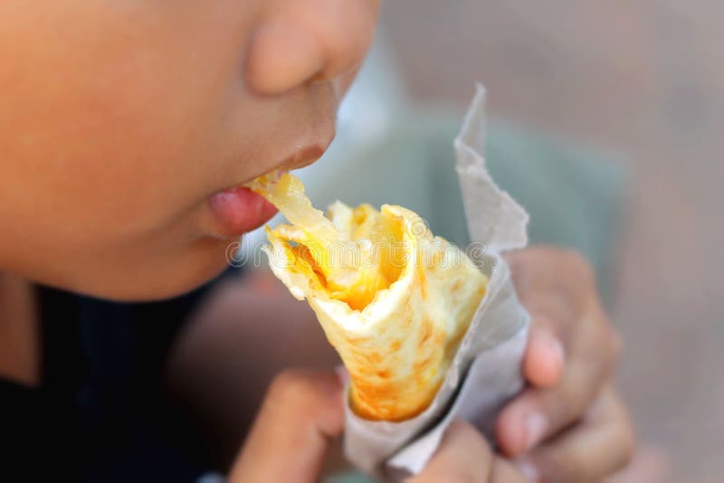 The Boy Eating Indian Chapati Breads or Roti Dough. Stock Image - Image ...