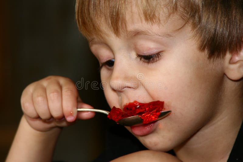 Boy eating jello stock image. Image of child, meal, mouth - 1878999