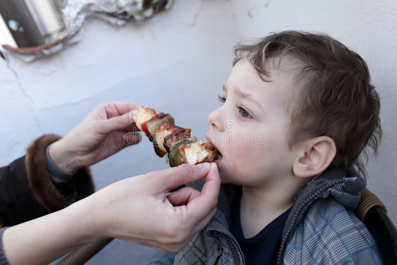 Boy eating kebab stock image. Image of cafe, mother, indoor - 41291117