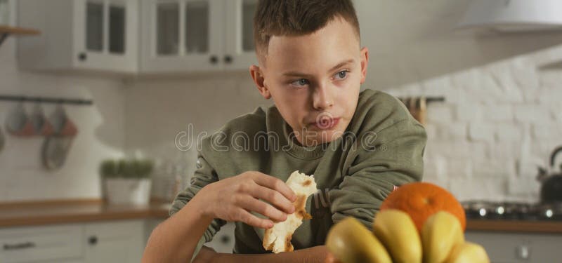 Boy Eating in Kitchen Alone Stock Image - Image of home, breakfast ...