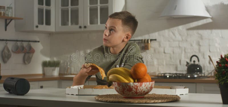 Boy Eating in Kitchen Alone Stock Image - Image of home, breakfast ...
