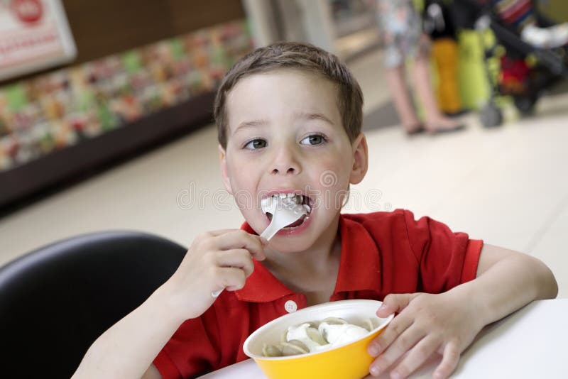 Boy Eating Meat Dumplings with Sour Cream Stock Photo - Image of meal ...
