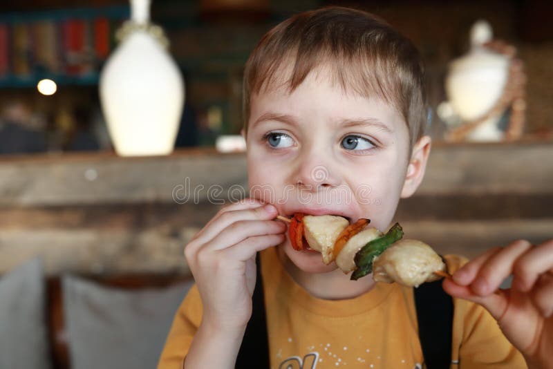 Boy Eating Meat Dumplings with Sour Cream Stock Photo - Image of meal ...