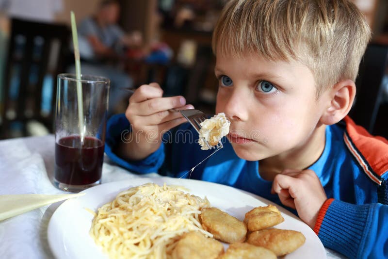 Boy Eating Nuggets with Spaghetti Stock Photo - Image of fast ...