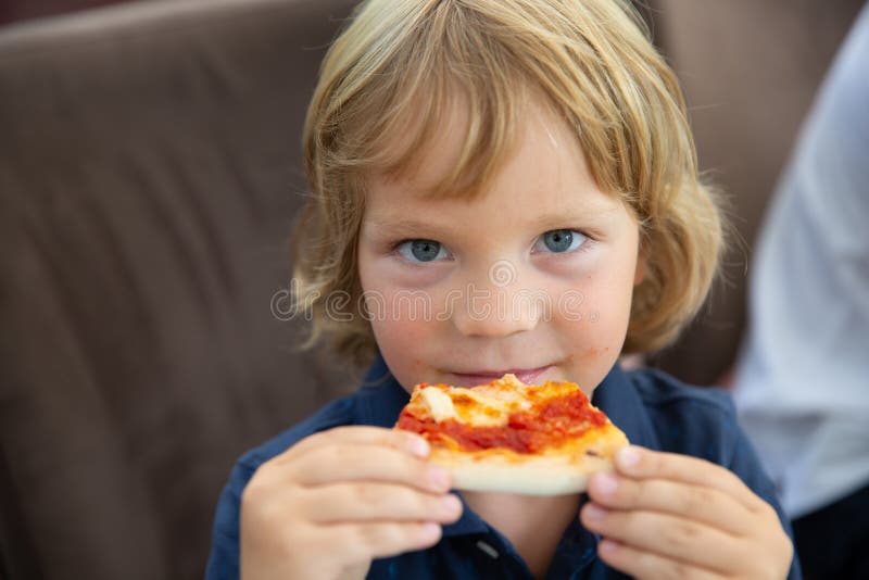 A boy eating Italian pizza stock vector. Illustration of restaurant ...