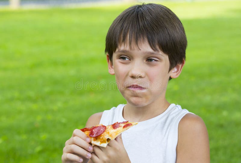 Boy eating pizza stock photo. Image of cooked, eating - 43208294