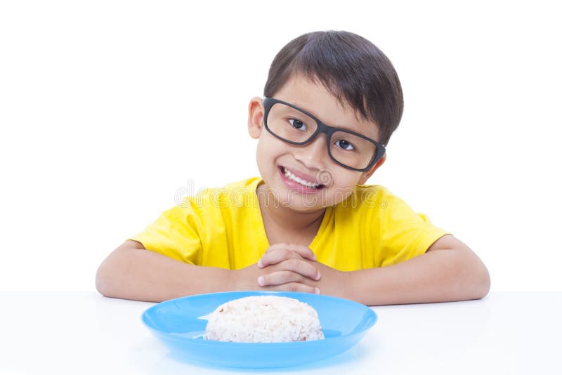 Boy eating rice. stock photo. Image of food, delicious - 47858768