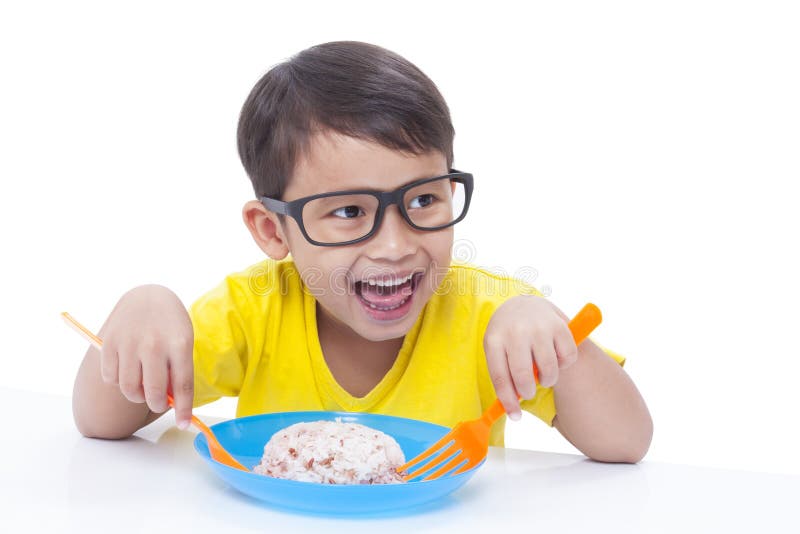 Boy eating rice. stock photo. Image of smile, dislike - 47641146