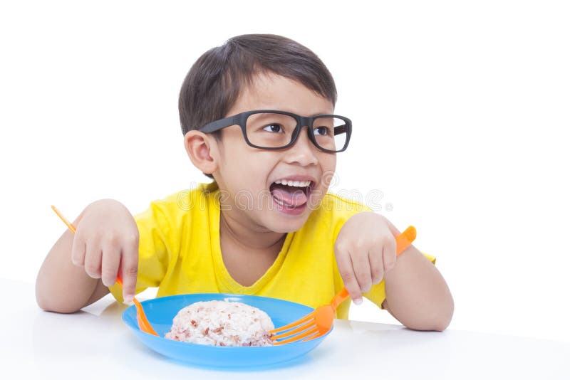 Boy eating rice. stock photo. Image of asia, large, breakfast - 47730024