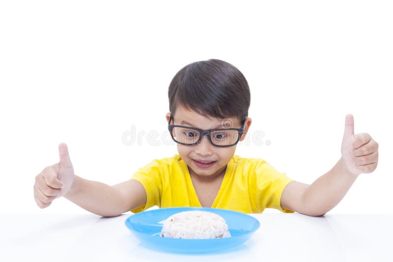 Boy eating rice. stock photo. Image of spoon, interior - 47641124