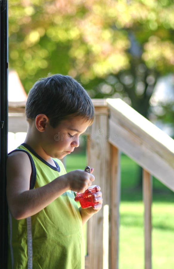 Boy Eating a Snack stock image. Image of food, green, happy - 1314577