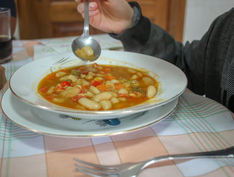 Eating with a Spoon a Dish of Beans Stock Image - Image of meal, eating ...