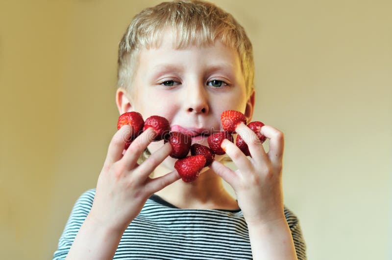 Boy eating strawberry stock image. Image of food, health - 14507995