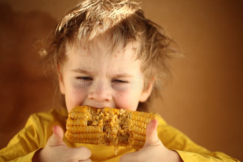 Boy Blonde Eating Sweet Corn Stock Photo - Image of holding, happy ...