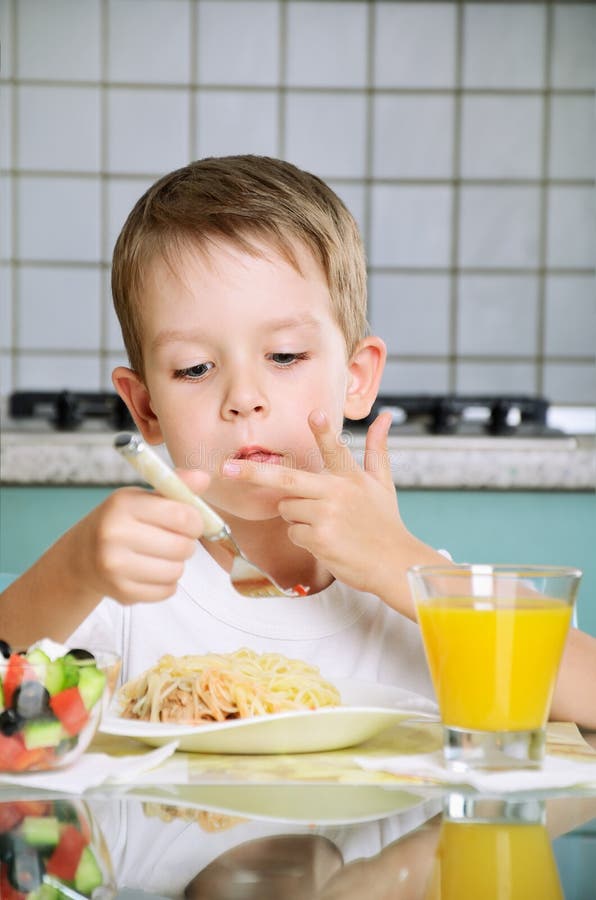 Boy Eating at the Table Vertical Stock Image - Image of bowl, eating ...
