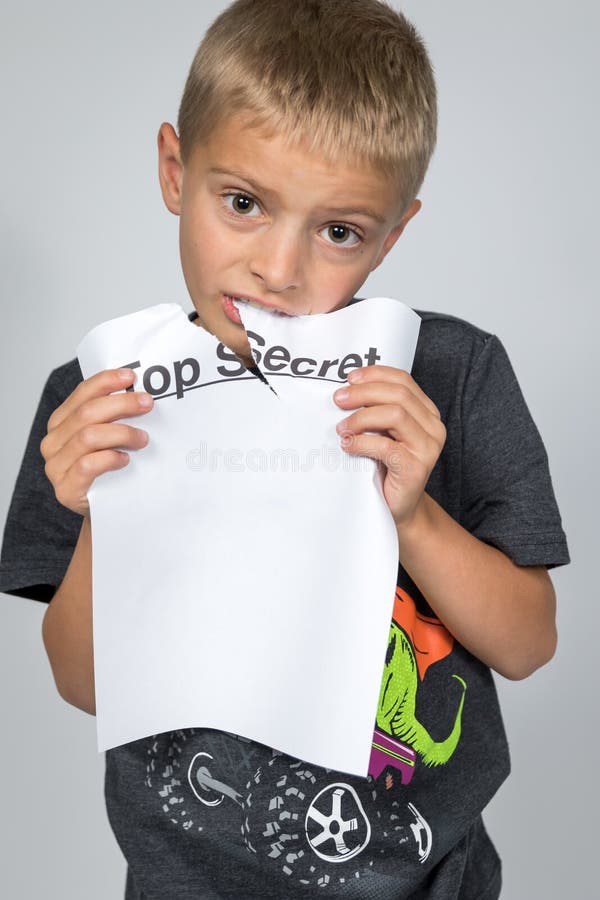 Boy Eating Top Secret Document Stock Photo - Image of person, holding ...