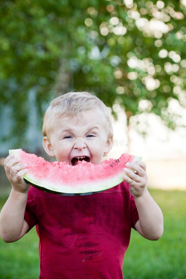 Boy eating watermelon stock image. Image of blond, portrait - 20970911