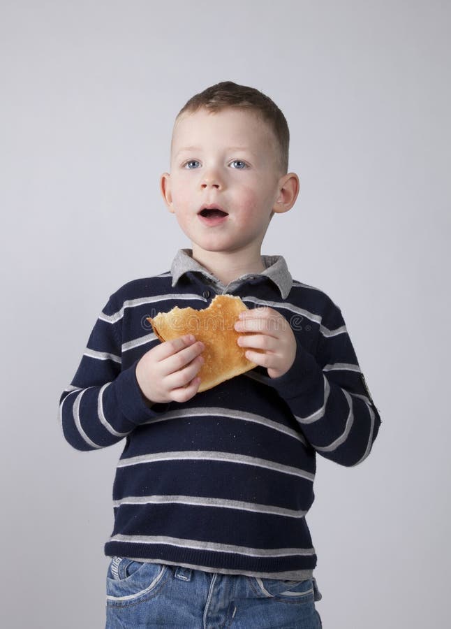 Boy eats bread stock photo. Image of little, hungry, portrait - 18674994