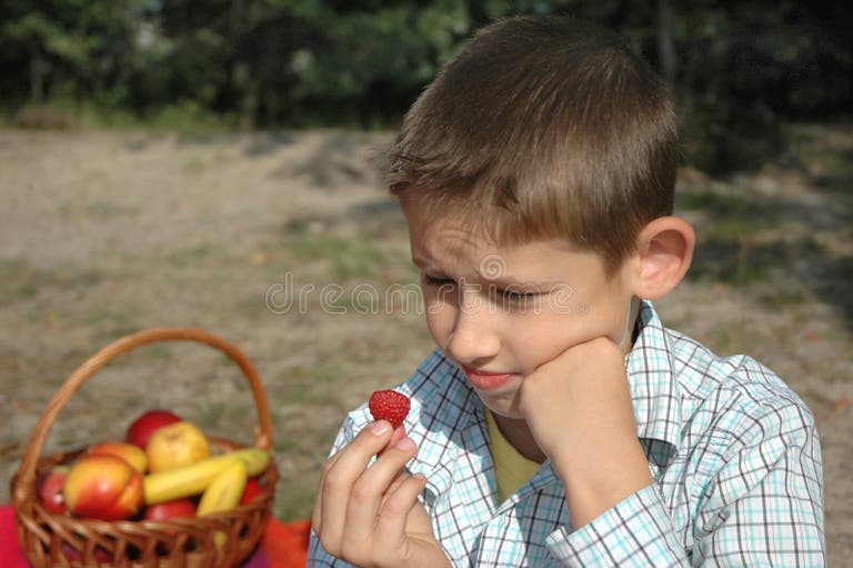 Boy eats raspberry stock photo. Image of raspberry, peach - 11516450
