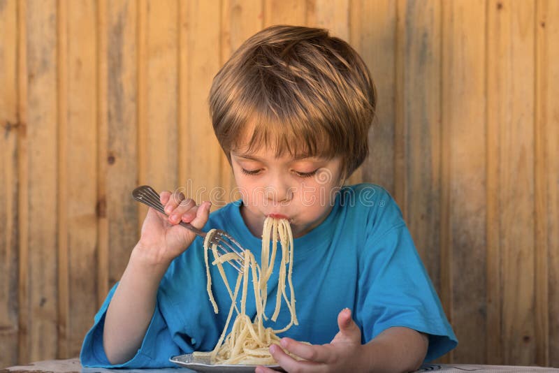 Boy Eats Spaghetti Parmesan Cheese Stock Photos - Free & Royalty-Free ...