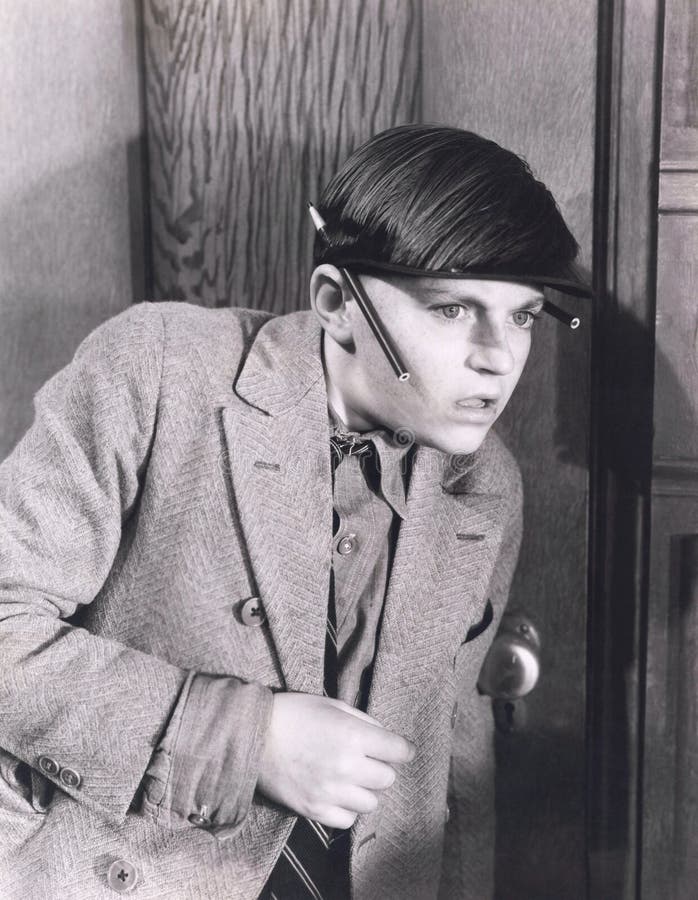 Boy eavesdropping at door stock image. Image of door - 59792349