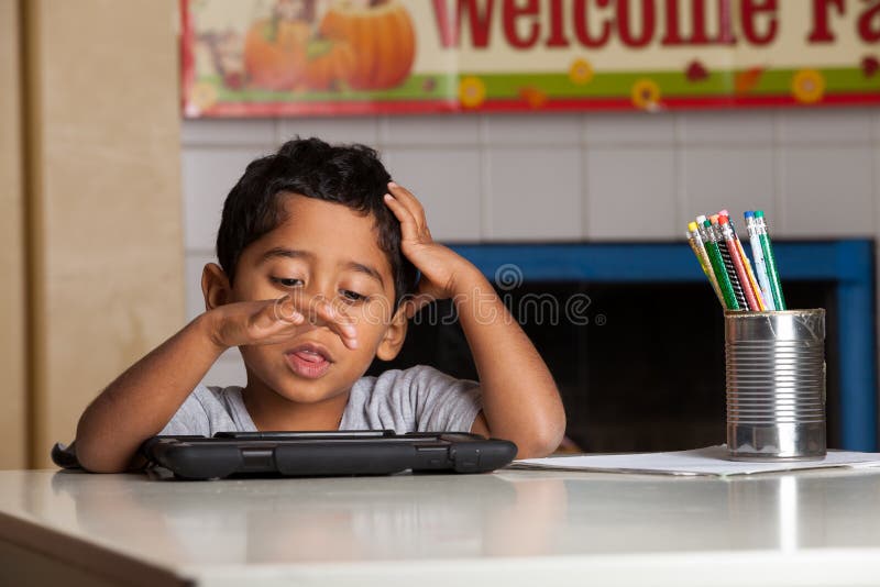 Hispanic Boy with Electronic Tablet Stock Photo - Image of home, child ...