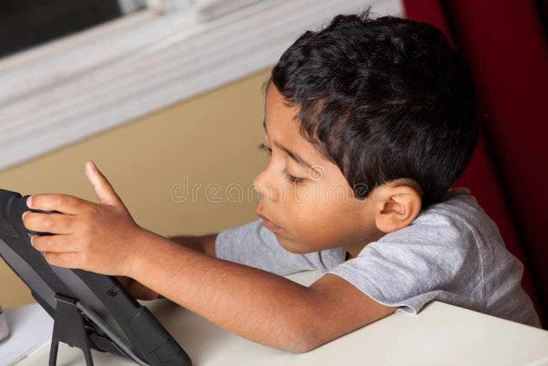 Hispanic Boy with Electronic Tablet Stock Photo - Image of home, child ...