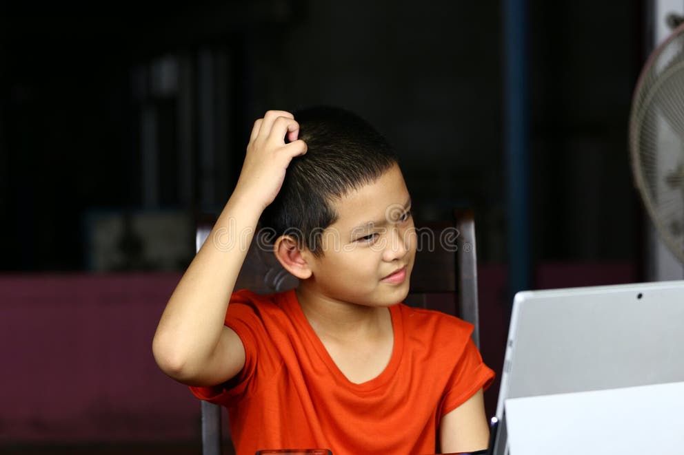 Boy Engaged in Learning with a Tablet Device Stock Photo - Image of ...