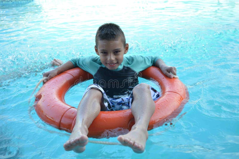 Boy enjoing pool day editorial photography. Image of pool - 48615532