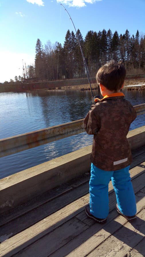 A boy enjoy fishing stock image. Image of bridge, child - 93044957
