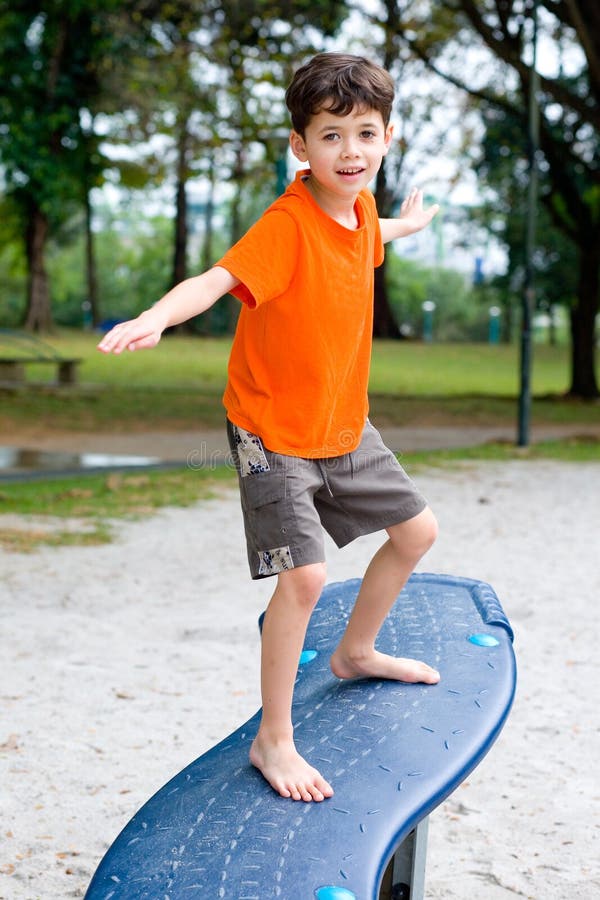 Boy Enjoying Balancing Beam Stock Photo - Image of park, happiness: 8027908