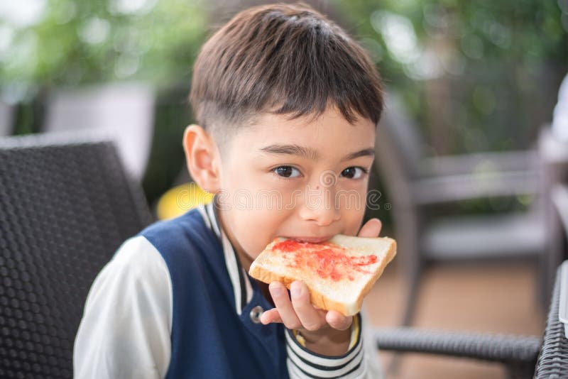 A Boy is Enjoying His Jam on Toast Stock Image - Image of home, asian ...