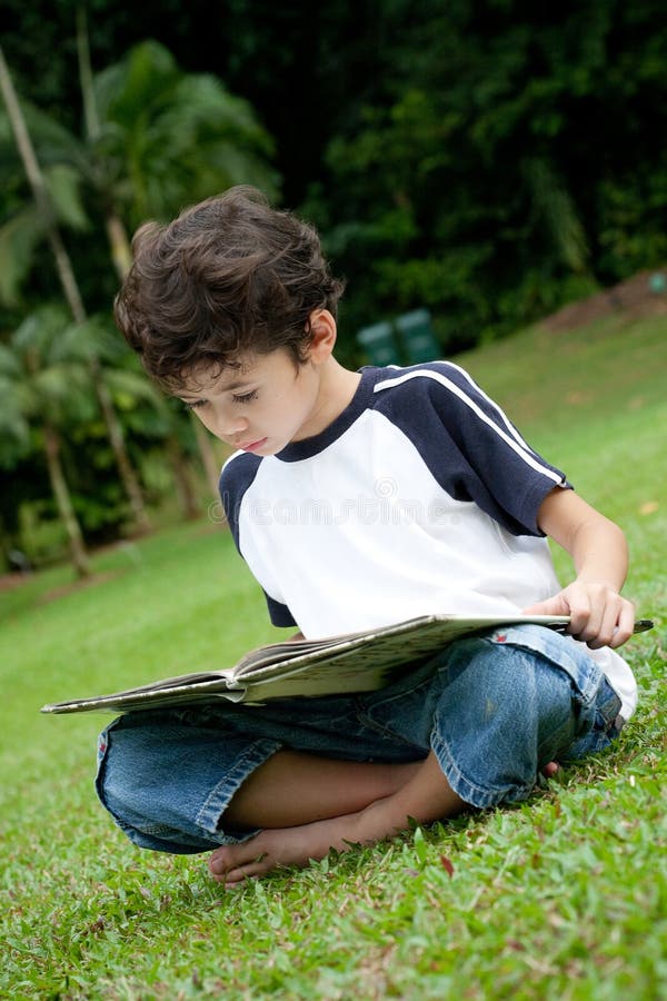 Young boy reading stock photo. Image of child, casual - 2484360