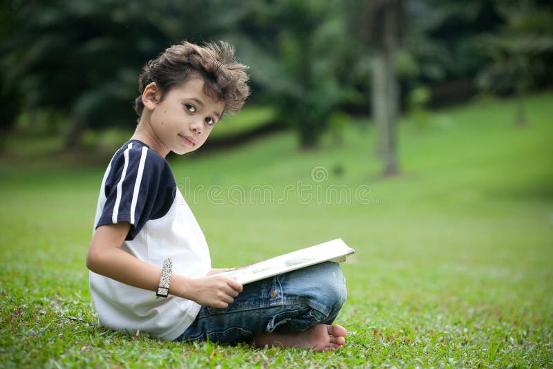 Boy Enjoying His Reading Book in Outdoor Park Stock Photo - Image of ...