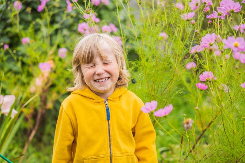 Boy Enjoying Pink Flowers in the Garden BANNER, LONG FORMAT Stock Image ...