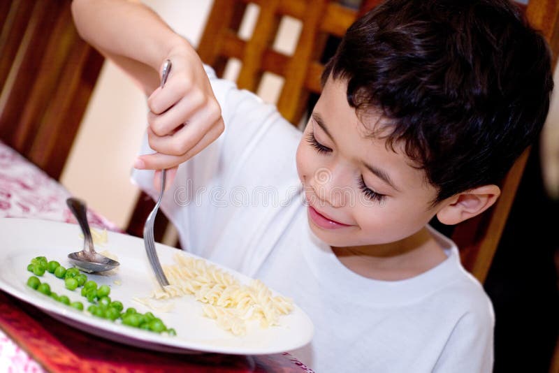 Boy Enjoying Plate of Pasta Stock Photo - Image of green, dinner: 7007498
