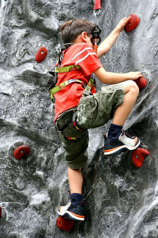 Boy enjoying rock climbing stock photo. Image of child - 2680992