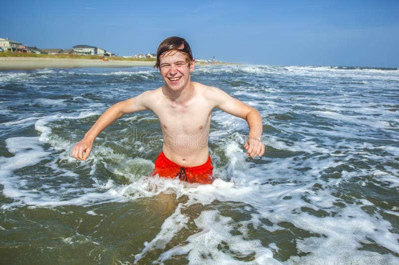 Boy Enjoys the Beautiful Ocean Stock Photo - Image of body, happy: 34402952