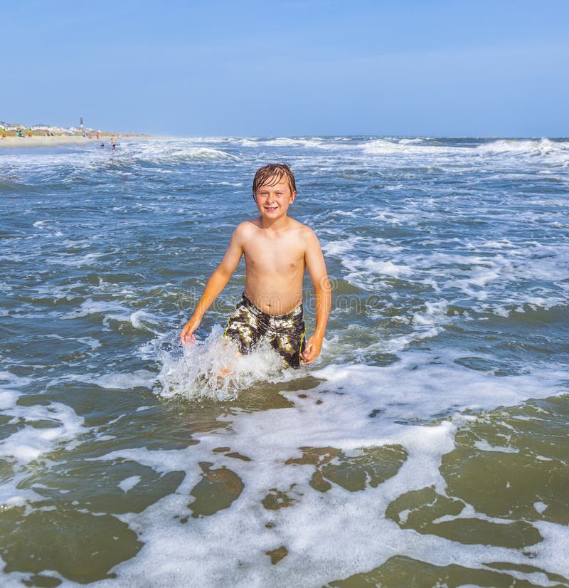 Boy Enjoys Vacation at the Ocean Stock Image - Image of blue, cute ...