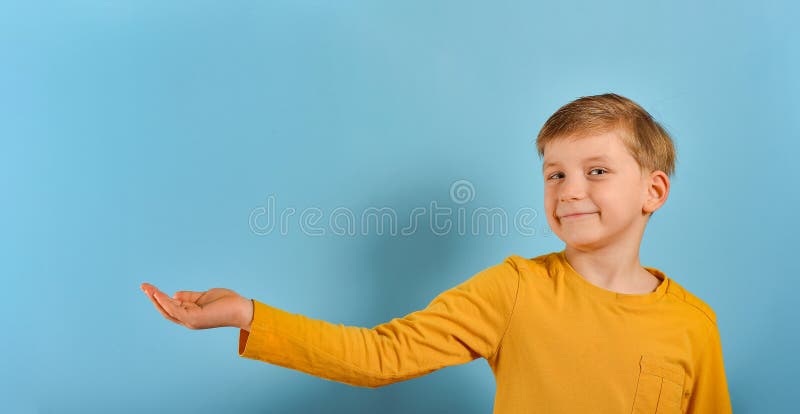 The Boy Extended His Right Hand To the Side for Advertising Stock Photo ...
