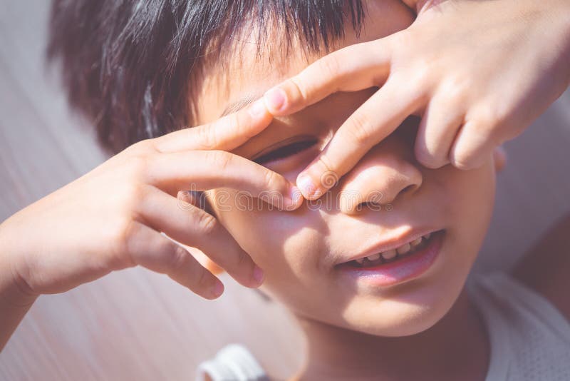 Portrait of Boy Eye Looking through His Hand Stock Photo - Image of ...