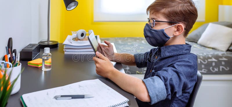 Boy with Face Mask Doing Homework with a Tablet Stock Photo - Image of ...