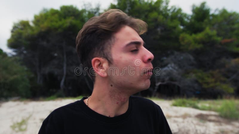 Boy with Facial Mental Tics Changes Expression Outside in Nature Stock ...