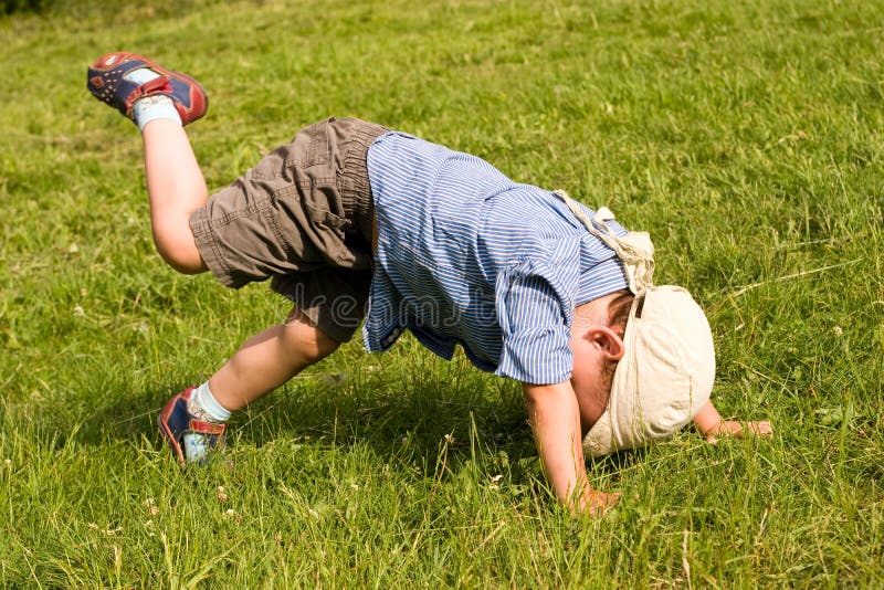 Boy fall down in park stock image. Image of overbalance - 19874243